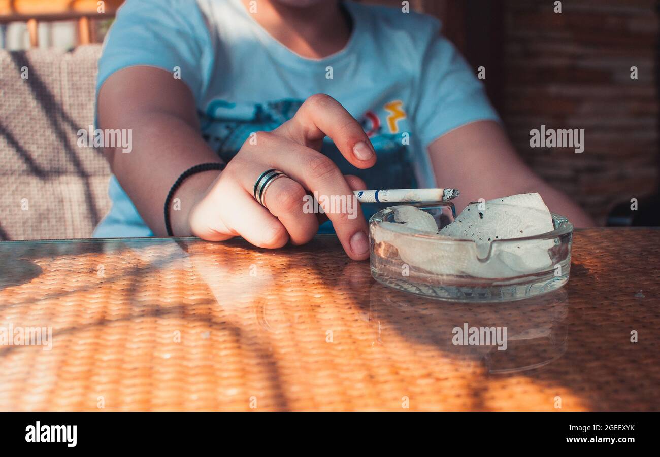 Boy with cigarette hi-res stock photography and images - Alamy