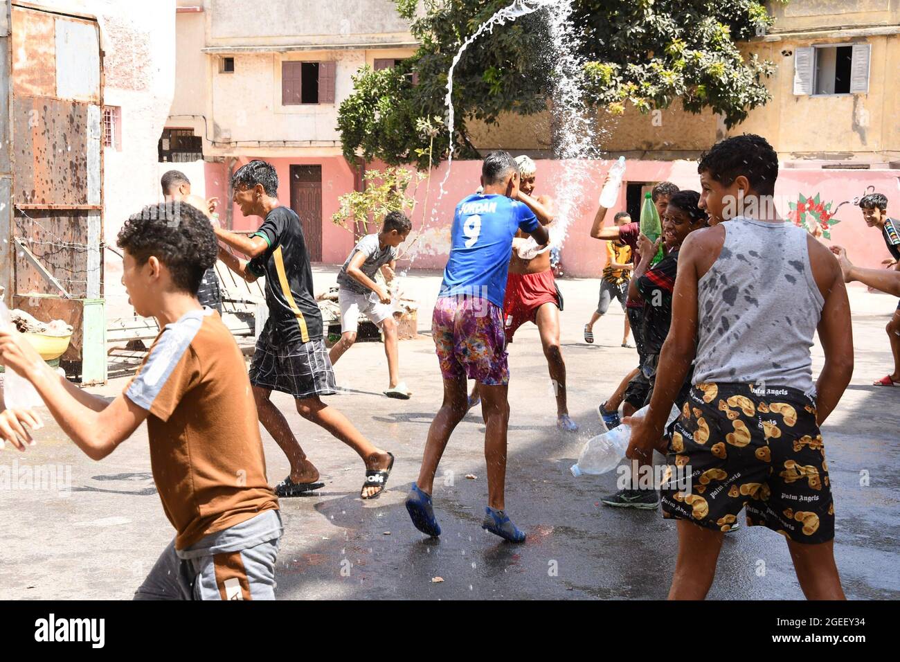 Rabat, Morocco. 19th Aug, 2021. Children play with water on Ashura in ...