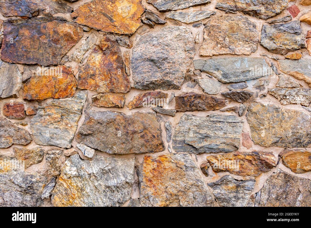 Natural colorful stones wall background for wallpapers Stock Photo - Alamy