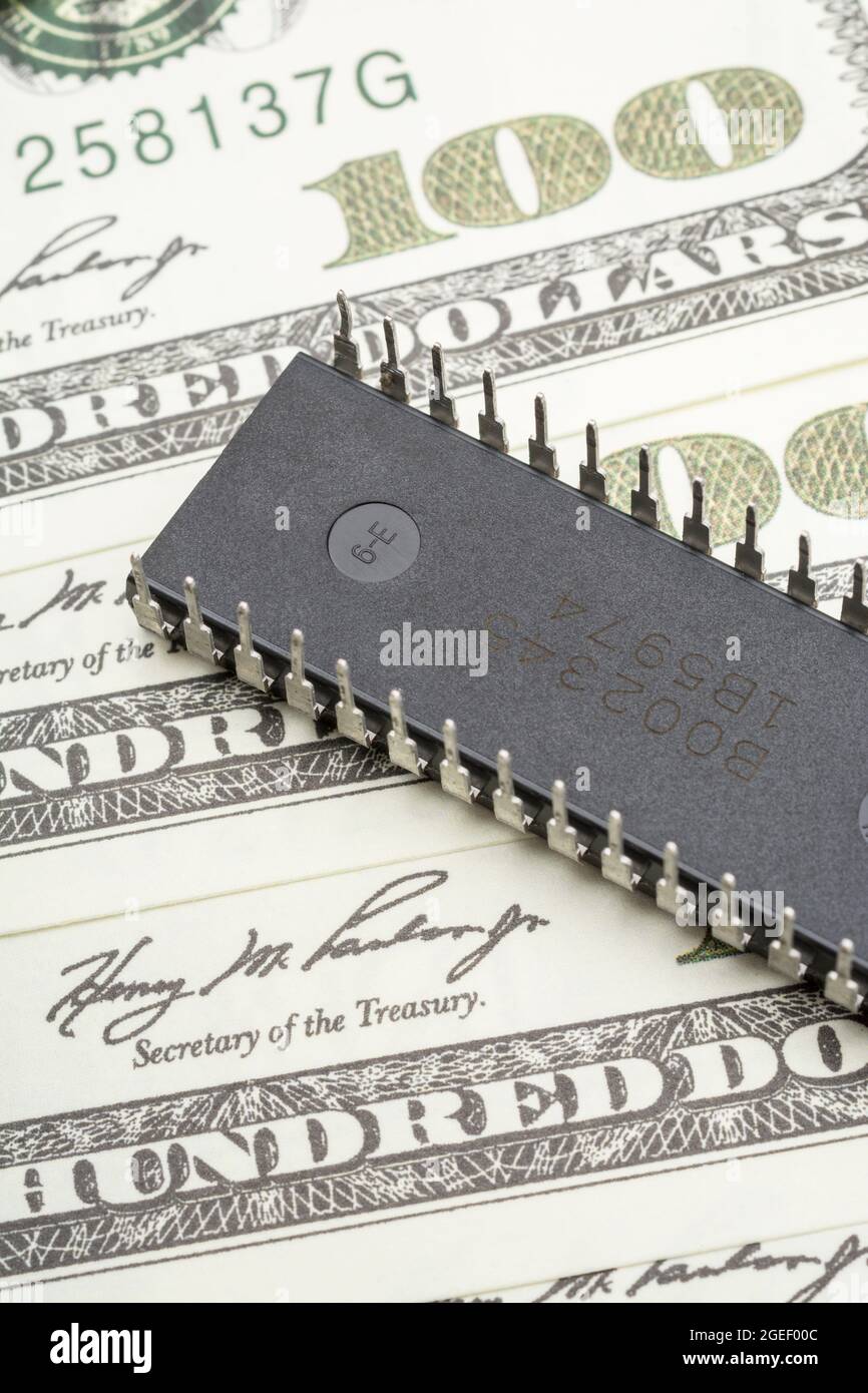 Close shot integrated circuit / eprom chip on US $100 / hundred dollar ...