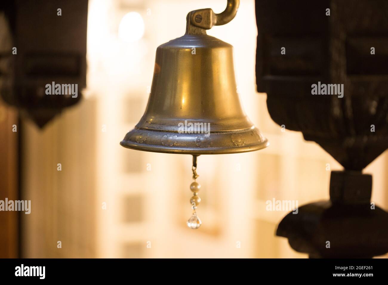 Selective of a golden bell in a temple Stock Photo - Alamy