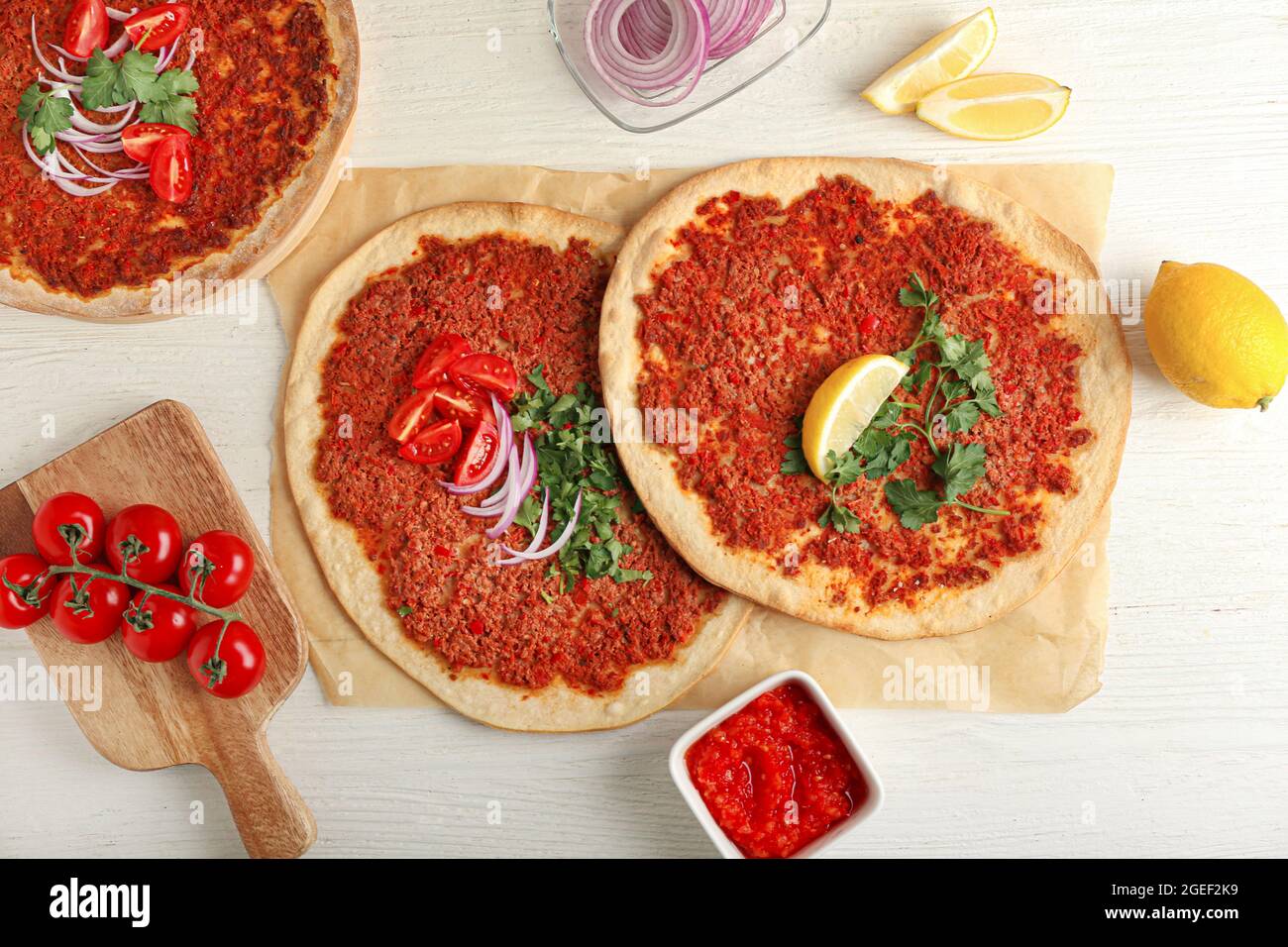 Delicious Turkish pizza on white wooden background Stock Photo - Alamy