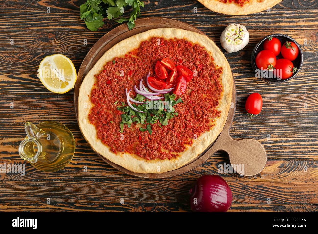 Board with delicious Turkish pizza on wooden background Stock Photo - Alamy