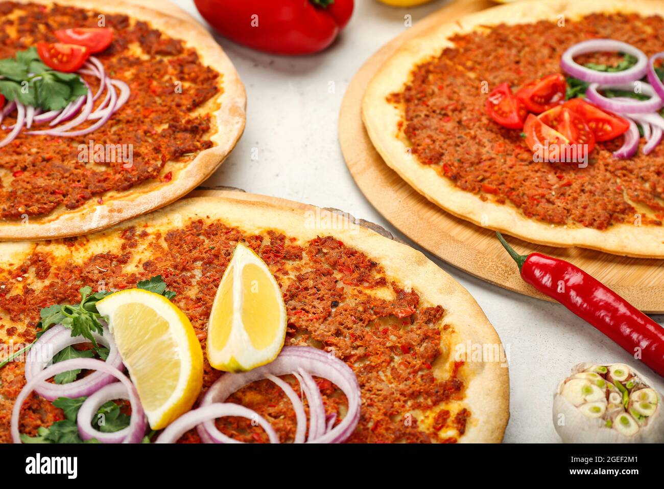 Boards with delicious Turkish pizza on light background Stock Photo - Alamy