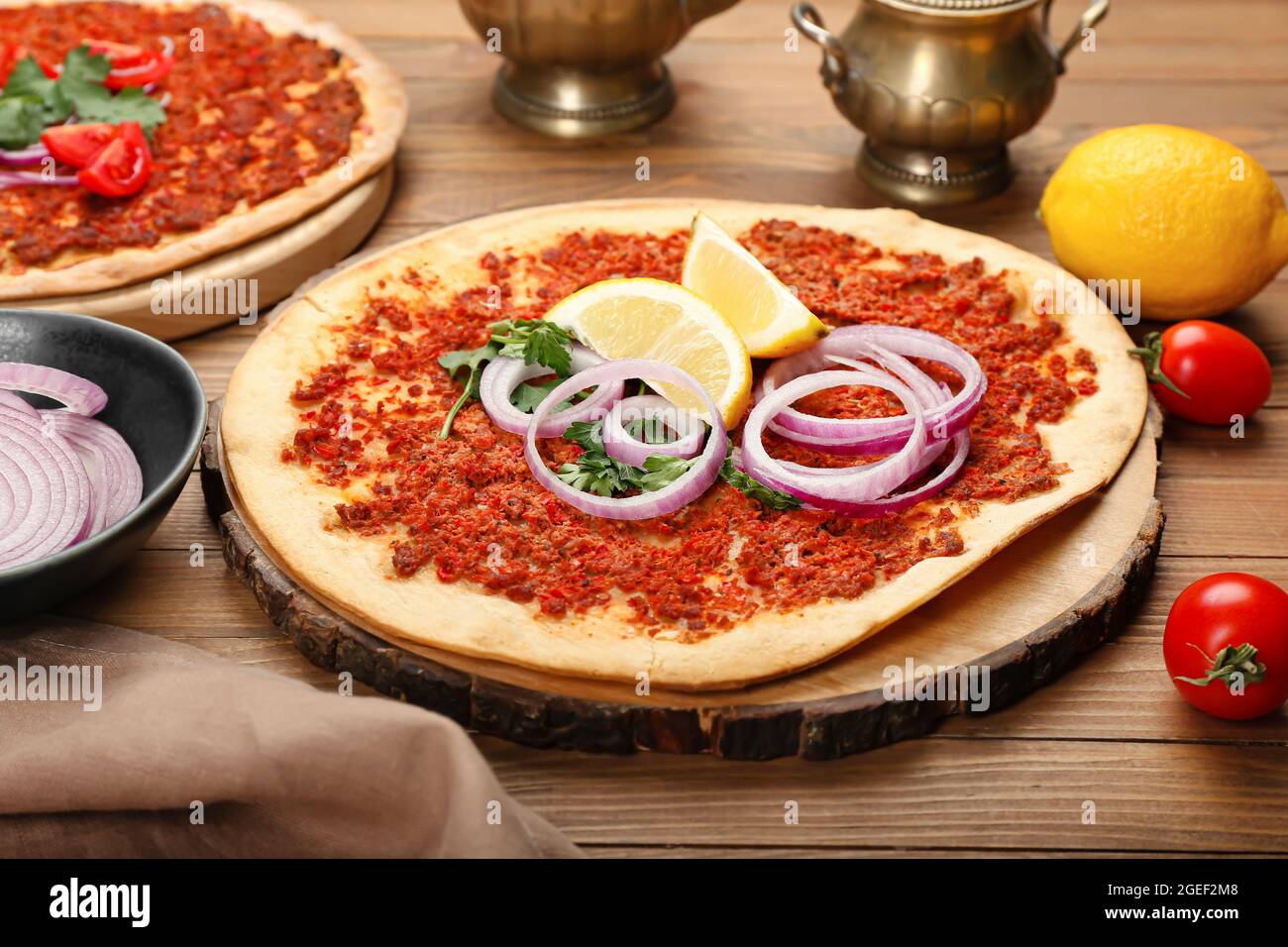 Board with delicious Turkish pizza on wooden background Stock Photo - Alamy