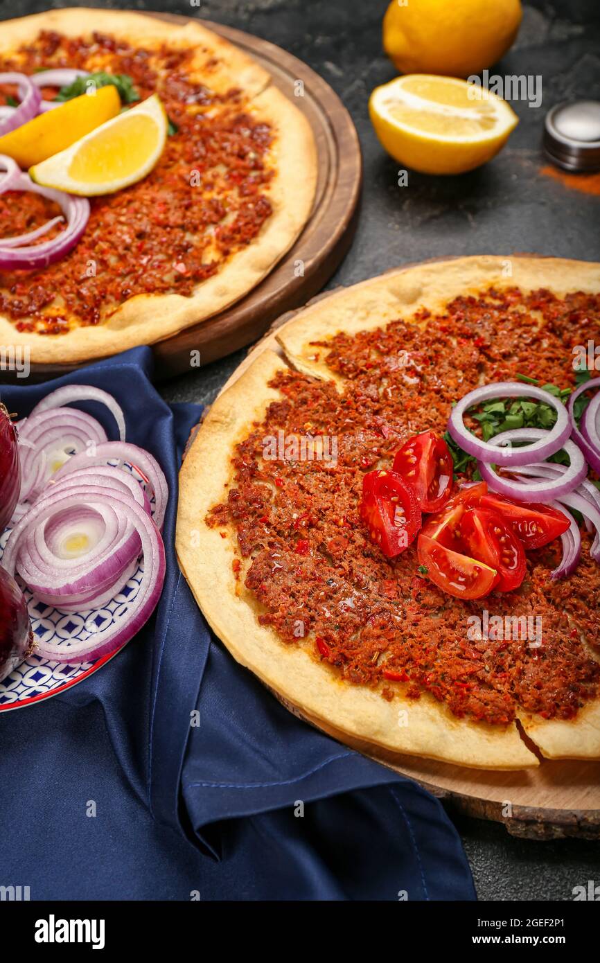 Boards with delicious Turkish pizza on dark background Stock Photo - Alamy