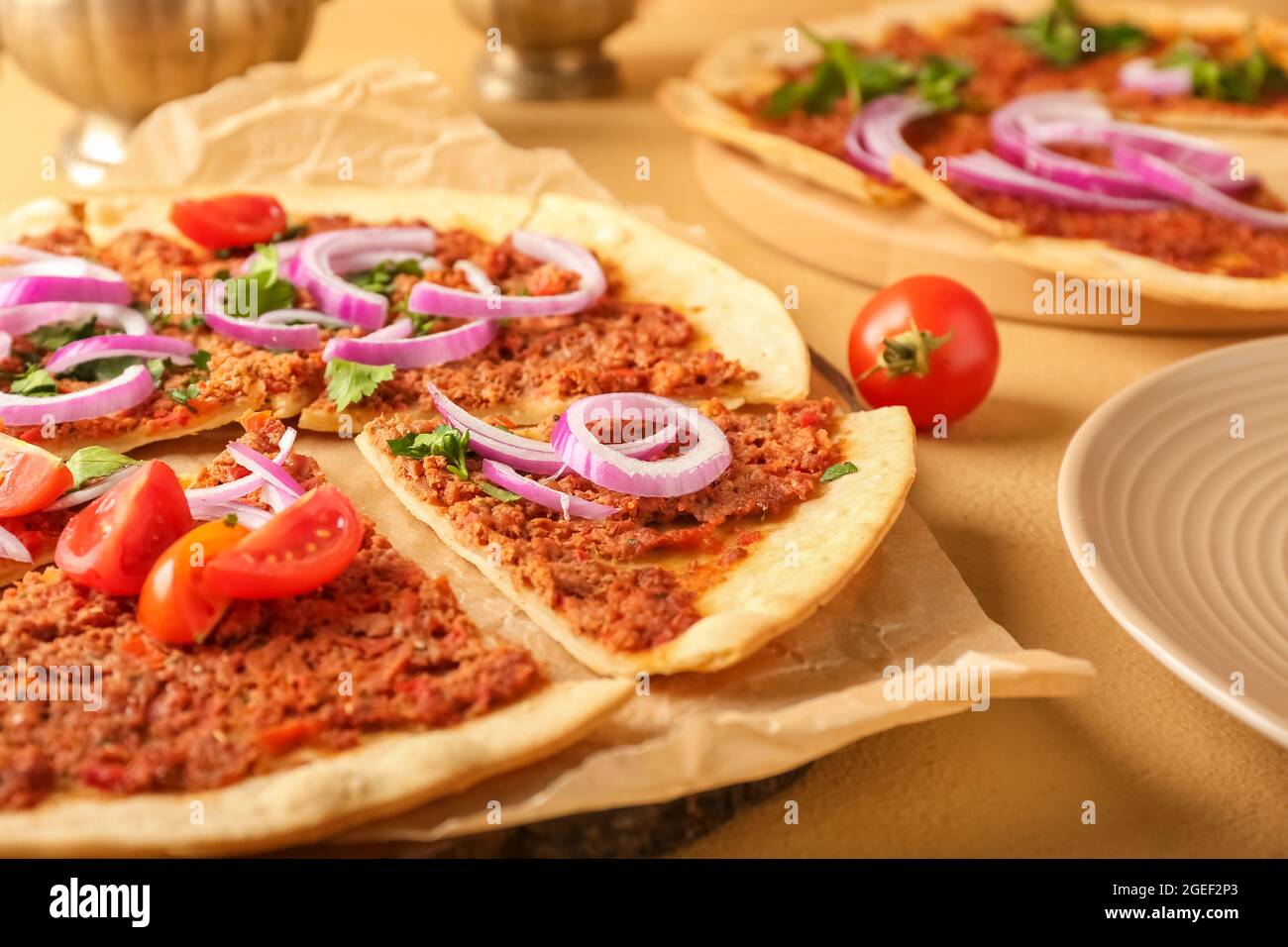 Delicious Turkish pizza on color background Stock Photo - Alamy