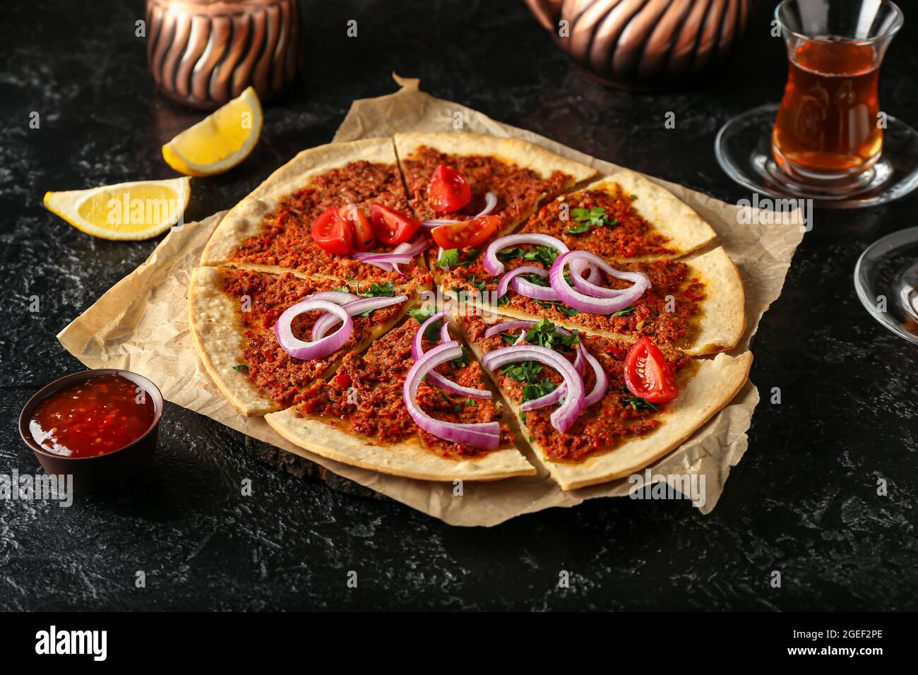 Delicious Turkish pizza on dark background Stock Photo - Alamy