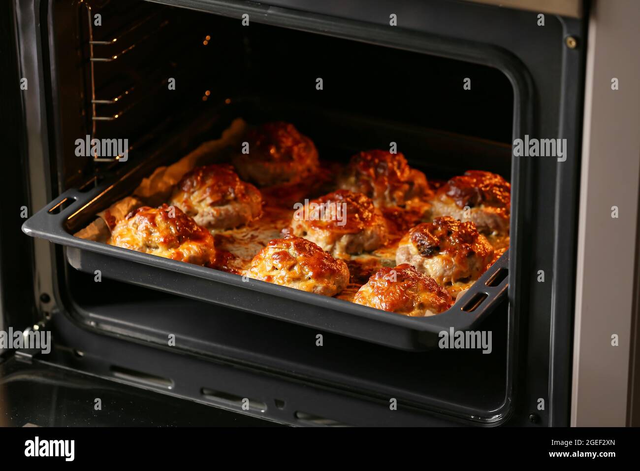 Baking tray with delicious minced meat boats, mushrooms and melted ...