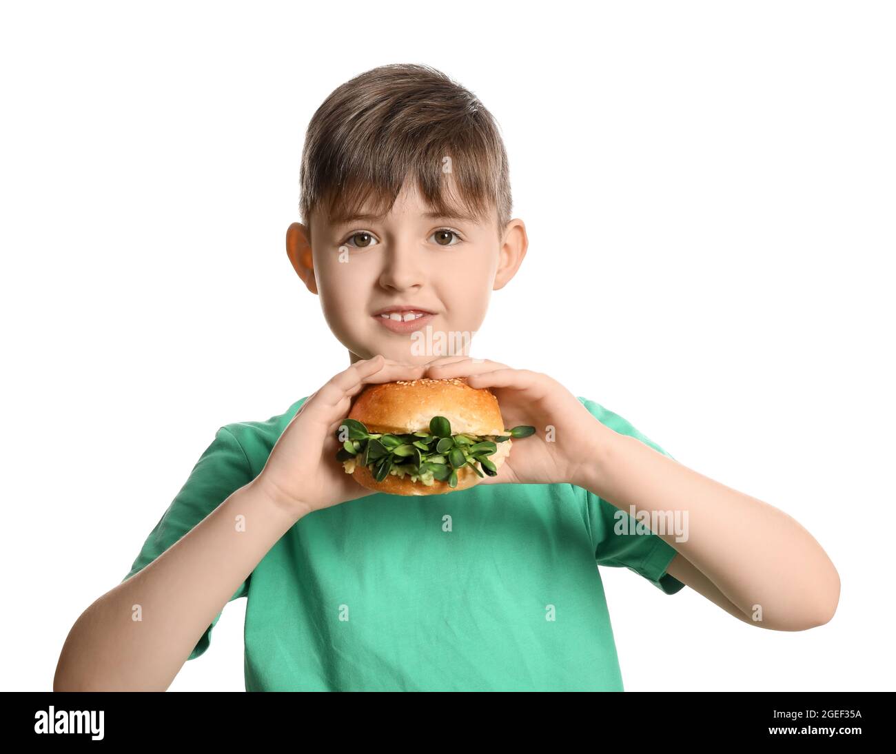 Little boy with tasty vegan burger on white background Stock Photo - Alamy