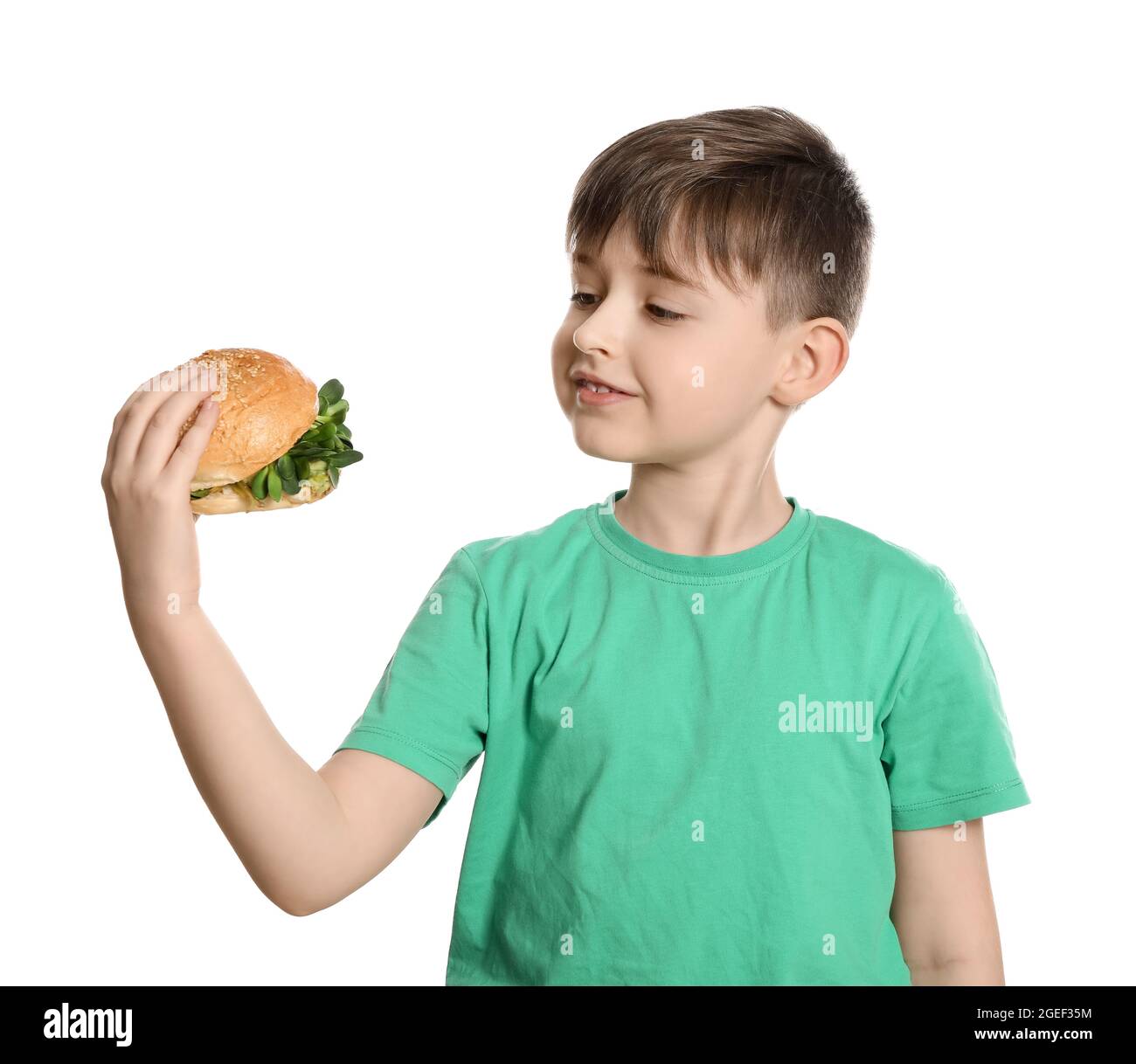 Little boy with tasty vegan burger on white background Stock Photo - Alamy