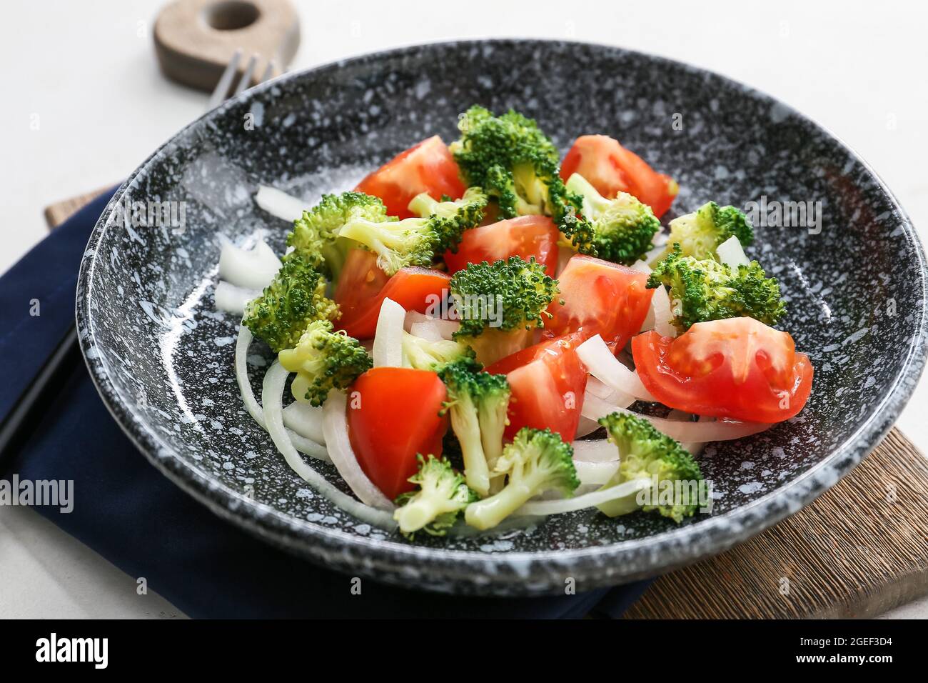 Plate of tasty salad with broccoli on light background Stock Photo - Alamy