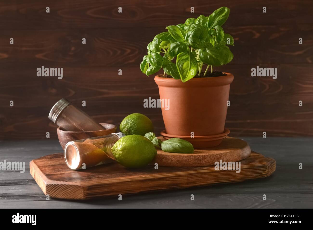 Fresh basil in pot, lime and spices on table Stock Photo - Alamy