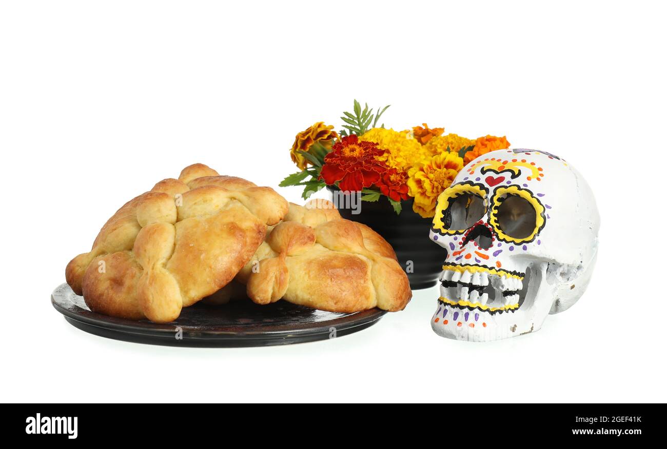 Bread of the dead and painted skull on white background. Celebration of ...