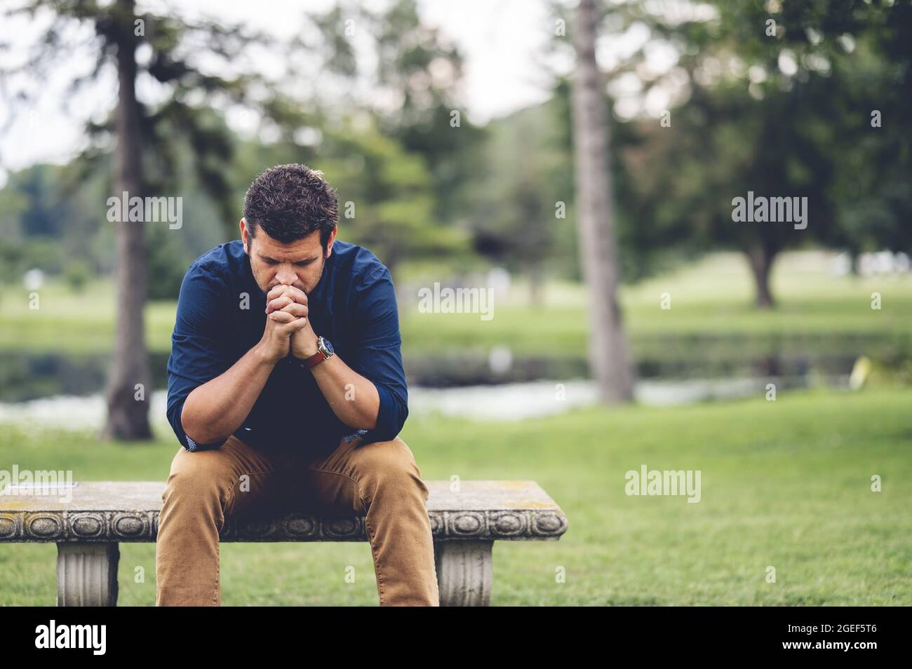 Man praying on bench hi-res stock photography and images - Alamy