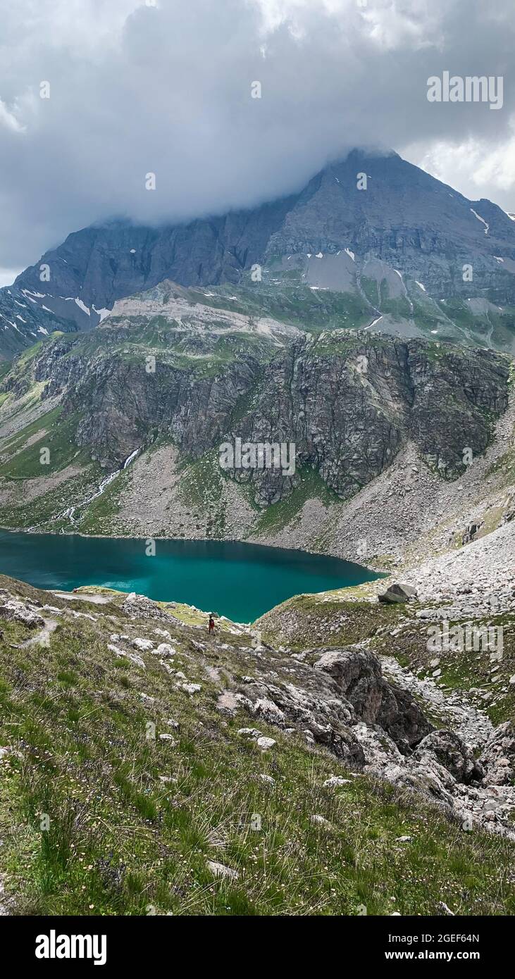 A beautiful lake at the base of a mountain range at the Gran Paradiso ...