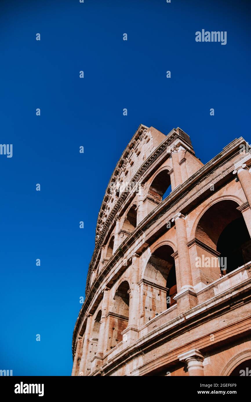 Vertical shot of the details of the facade of the Colosseum in Rome ...