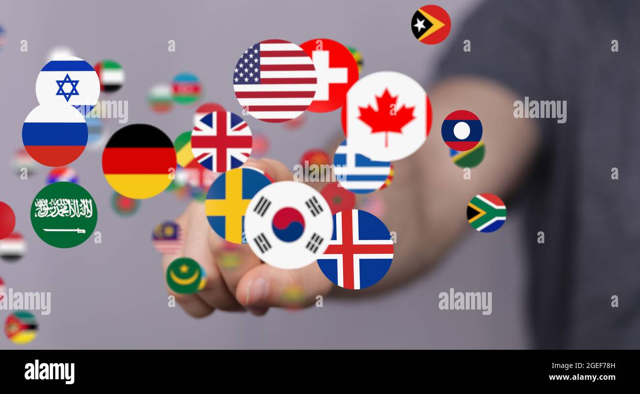 Hand selecting from a network of international flags Stock Photo - Alamy