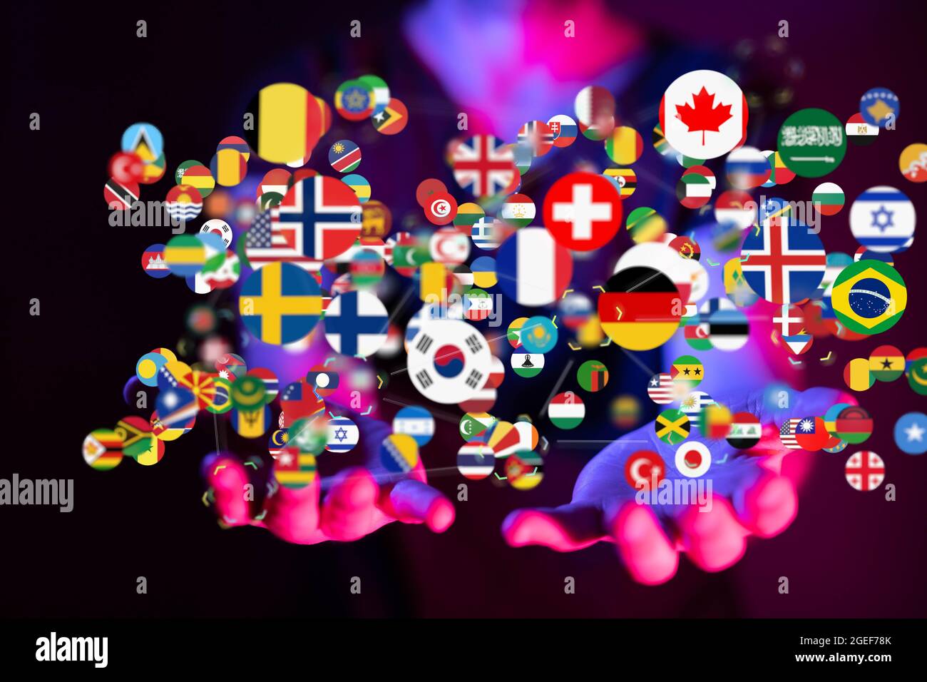 Pair of hands holding a floating network of international flag symbols ...