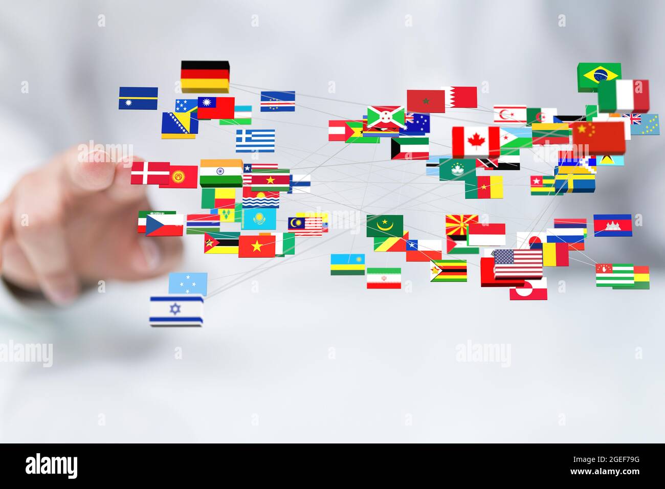 Hand selecting from an interconnected network of international flags ...