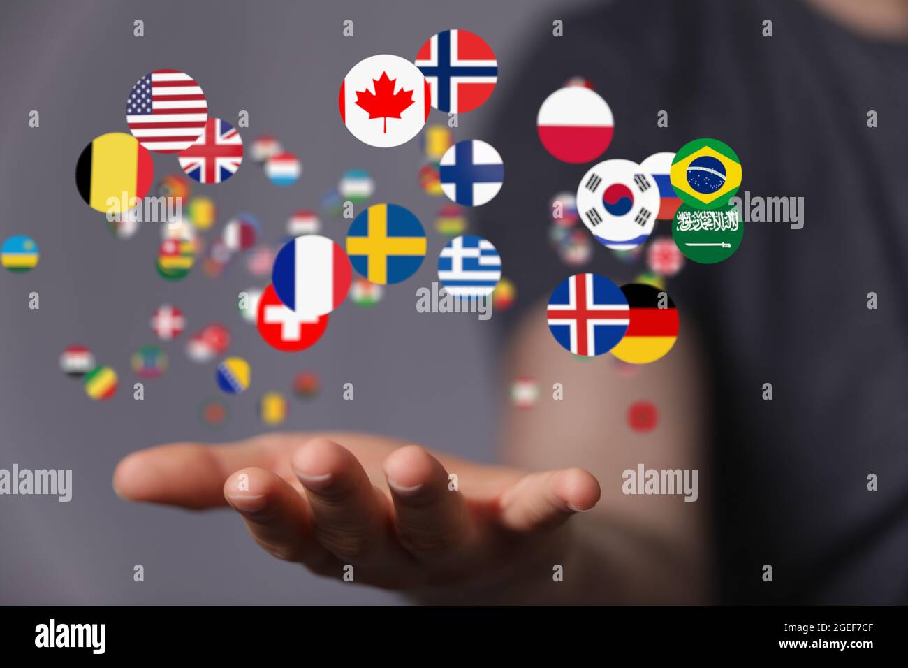 Hand holding an interconnected network of international flags Stock ...
