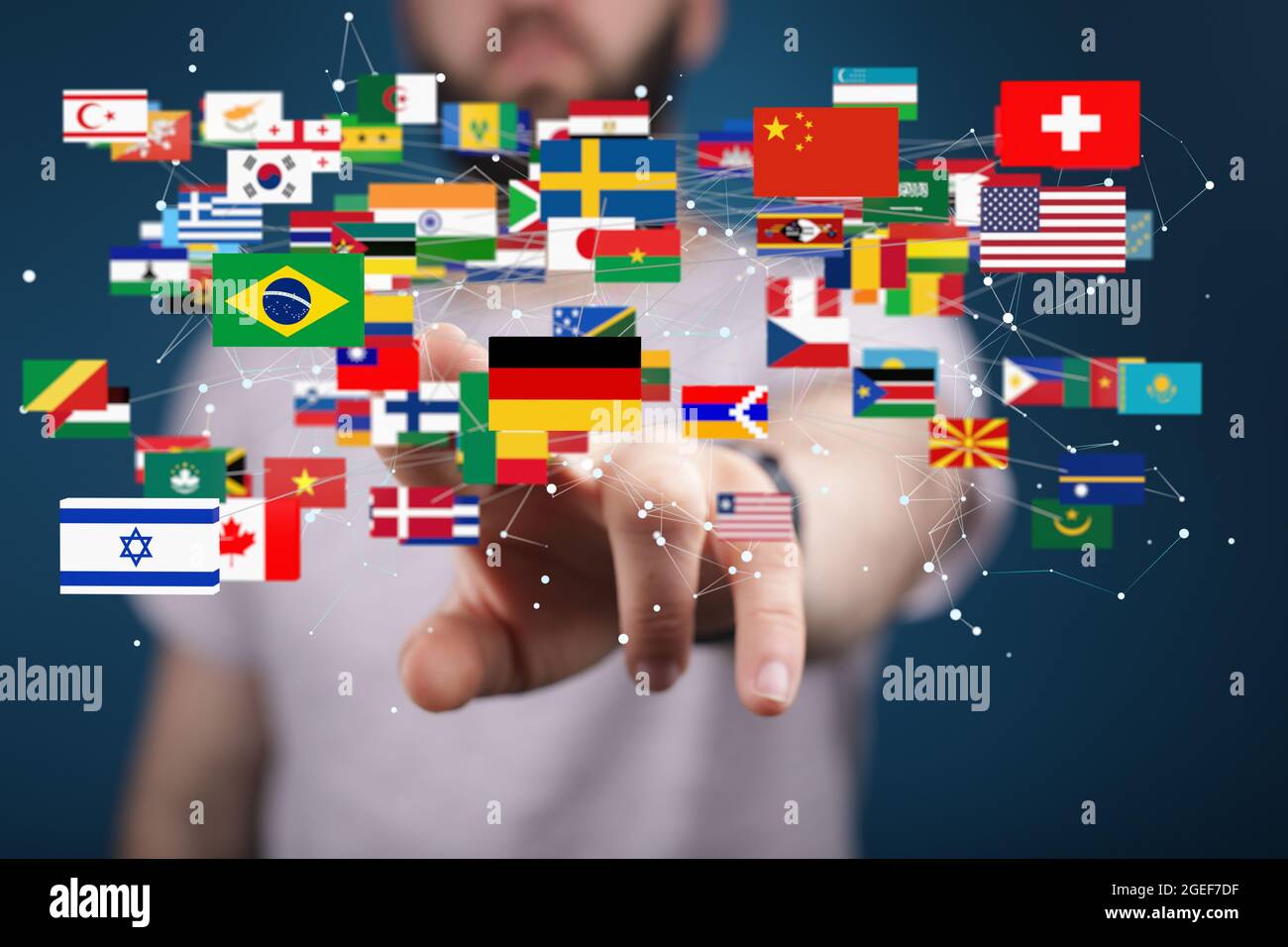 Hand selecting from an interconnected network of international flags ...