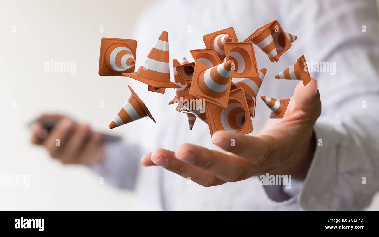 3D render of floating traffic cones over a businessman's hands- site ...