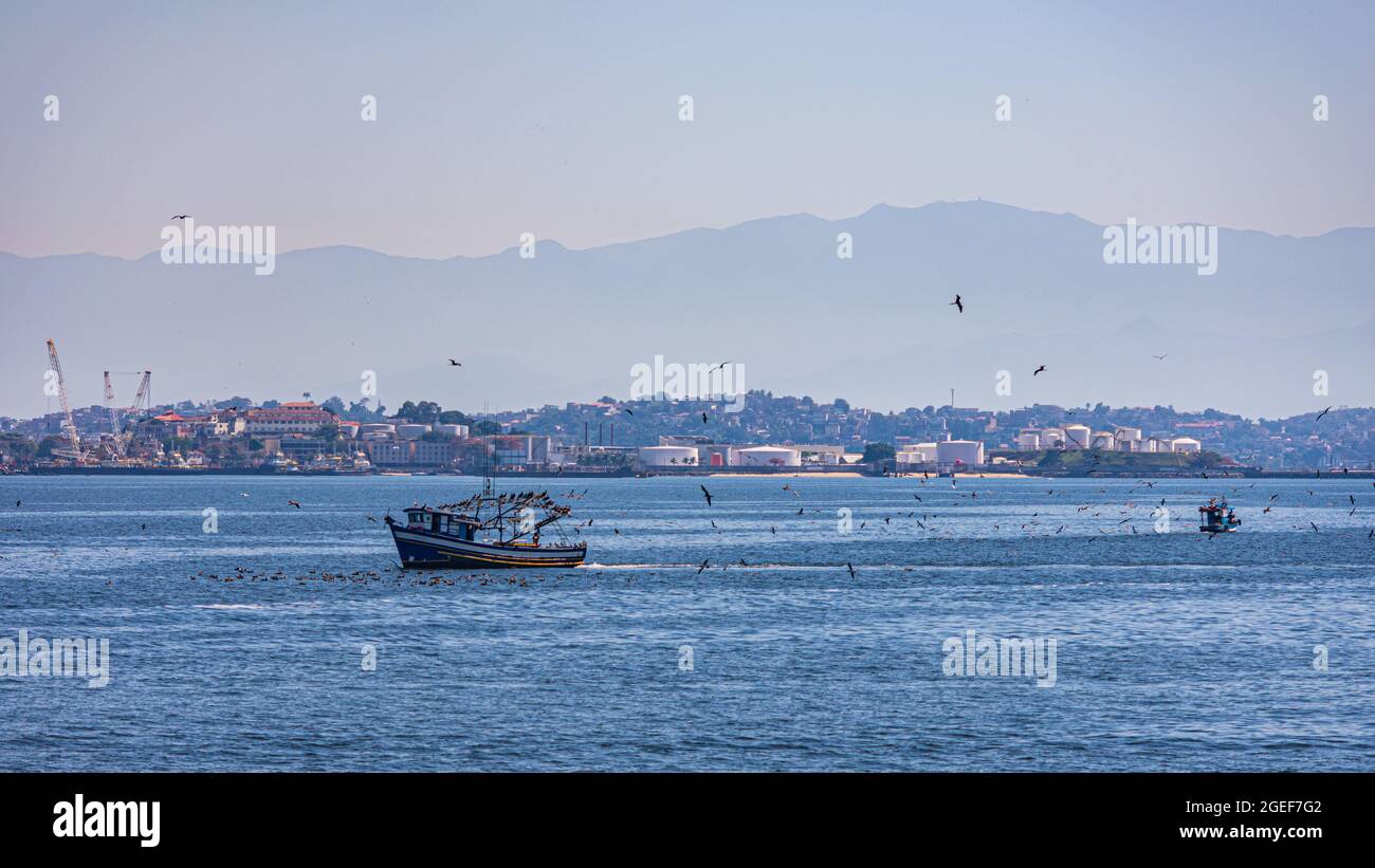 Rio de Janeiro, Brazil - CIRCA 2021: Fishing boat surrounded by ...