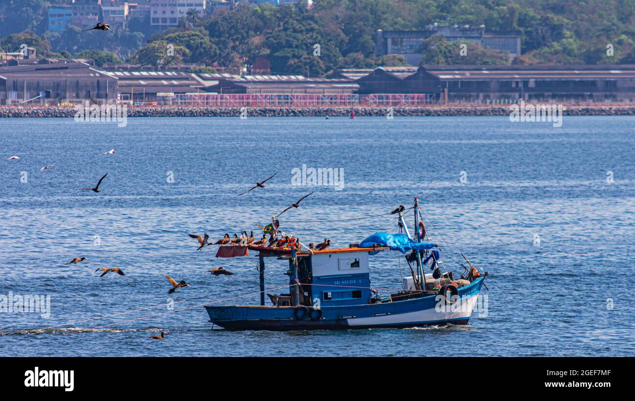 Rio de Janeiro, Brazil - CIRCA 2021: Fishing boat surrounded by ...