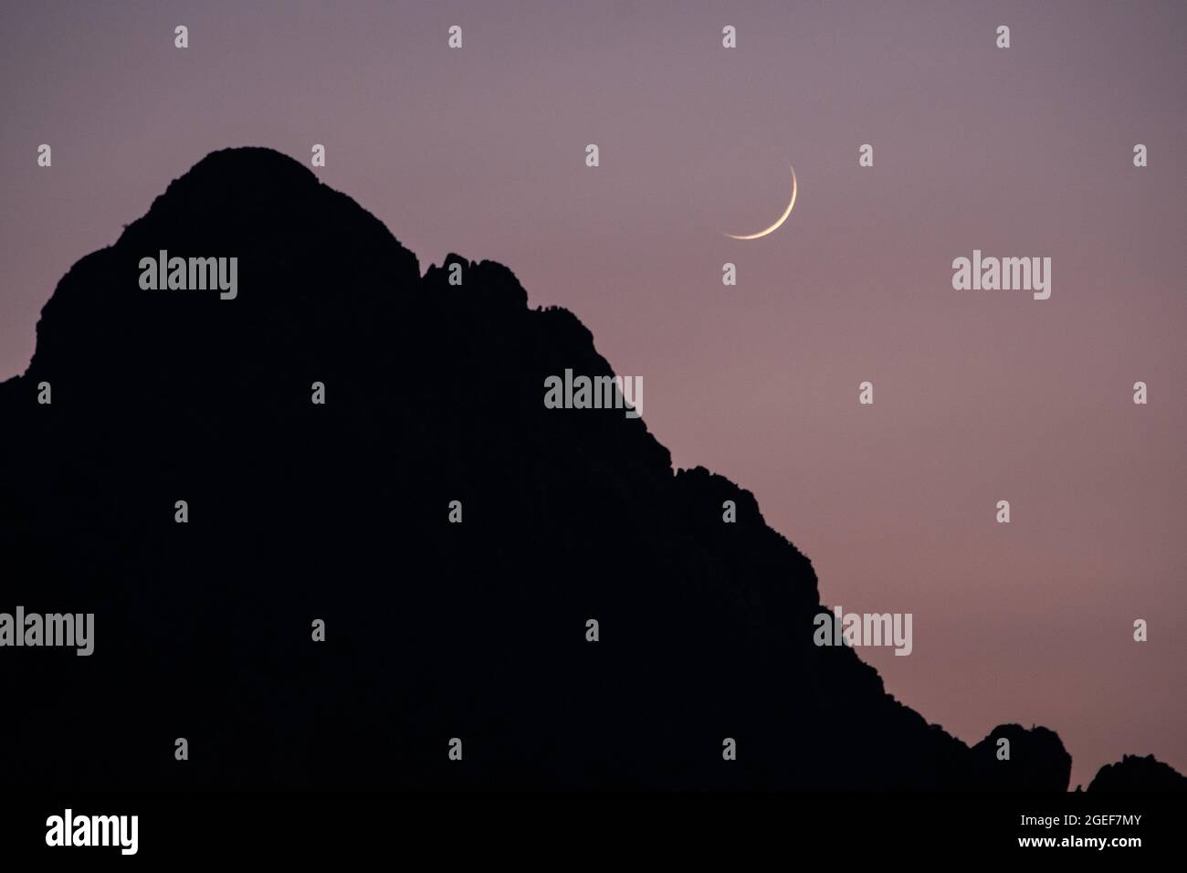 Crescent moon and Ragged Top Mountains Stock Photo - Alamy