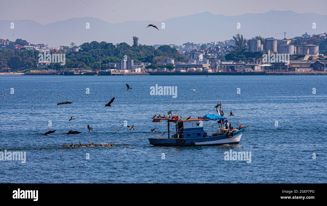 Rio de Janeiro, Brazil - CIRCA 2021: Fishing boat surrounded by ...