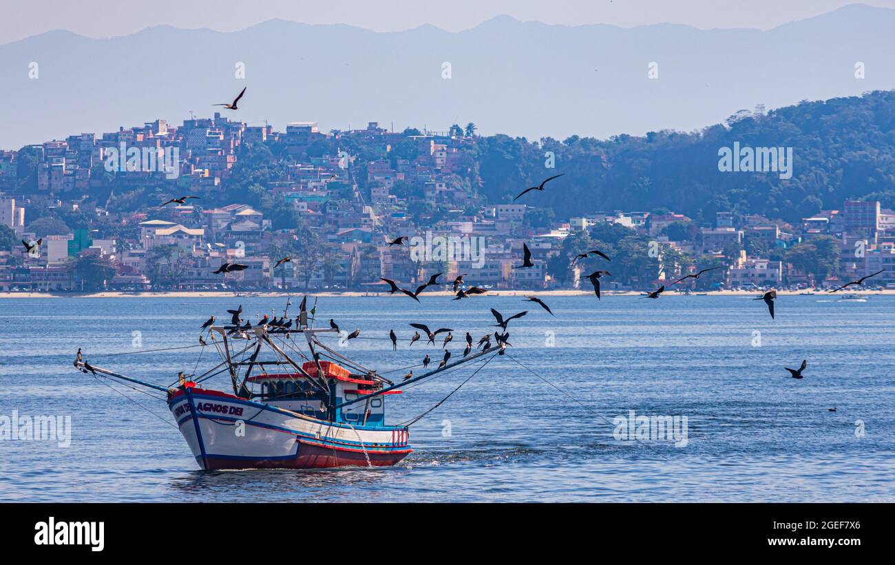 Rio de Janeiro, Brazil - CIRCA 2021: Fishing boat surrounded by ...