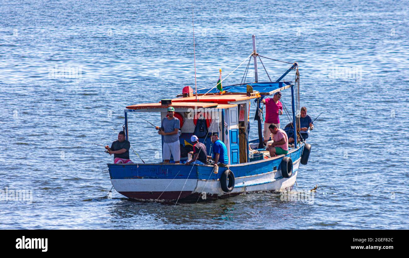 Rio de Janeiro, Brazil - CIRCA 2021: Fishing boat surrounded by ...