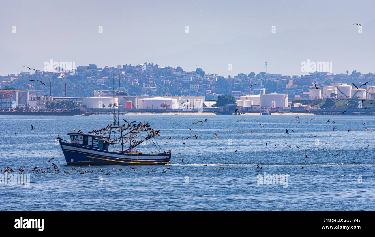 Rio de Janeiro, Brazil - CIRCA 2021: Fishing boat surrounded by ...