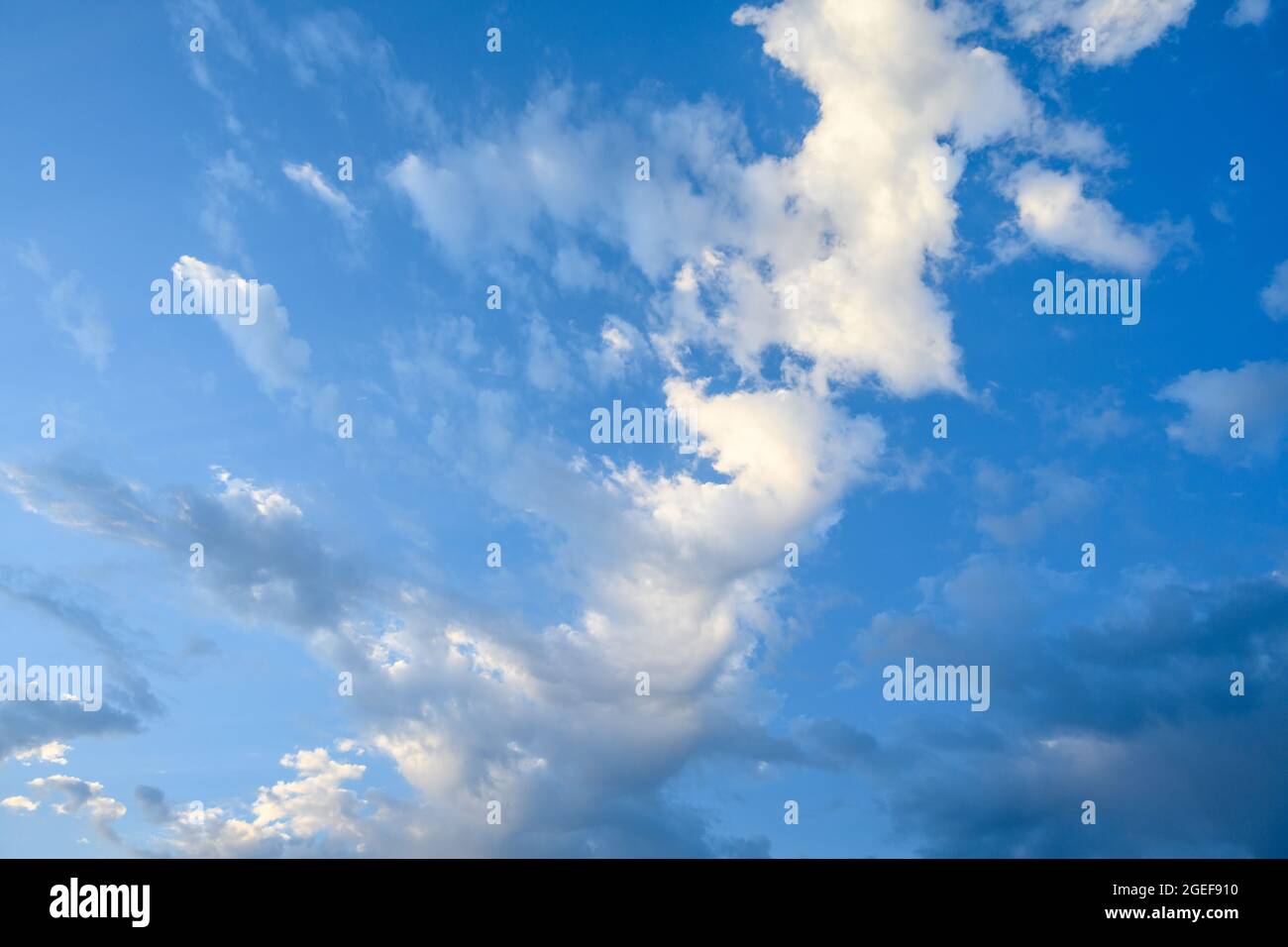 Blue and white dramatic sky, with striking clouds, as a nature ...