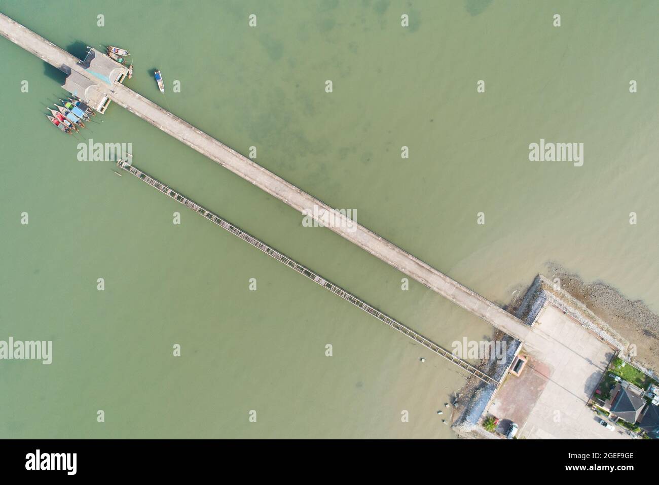 Aerial top view drone shot of small bridge in the sea image ...