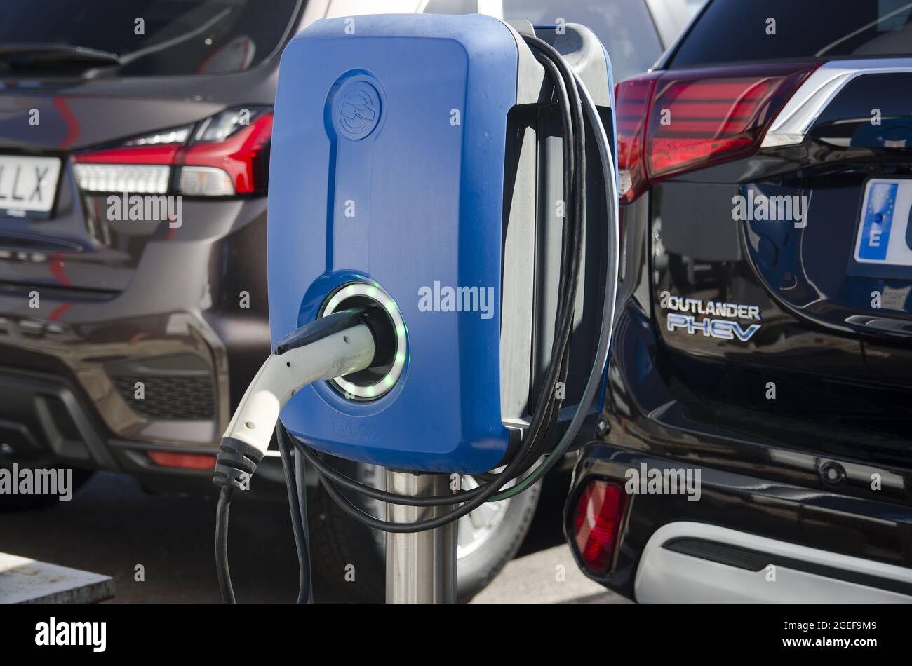MADRID, SPAIN - Aug 08, 2021: A modern electric car plugged into the ...