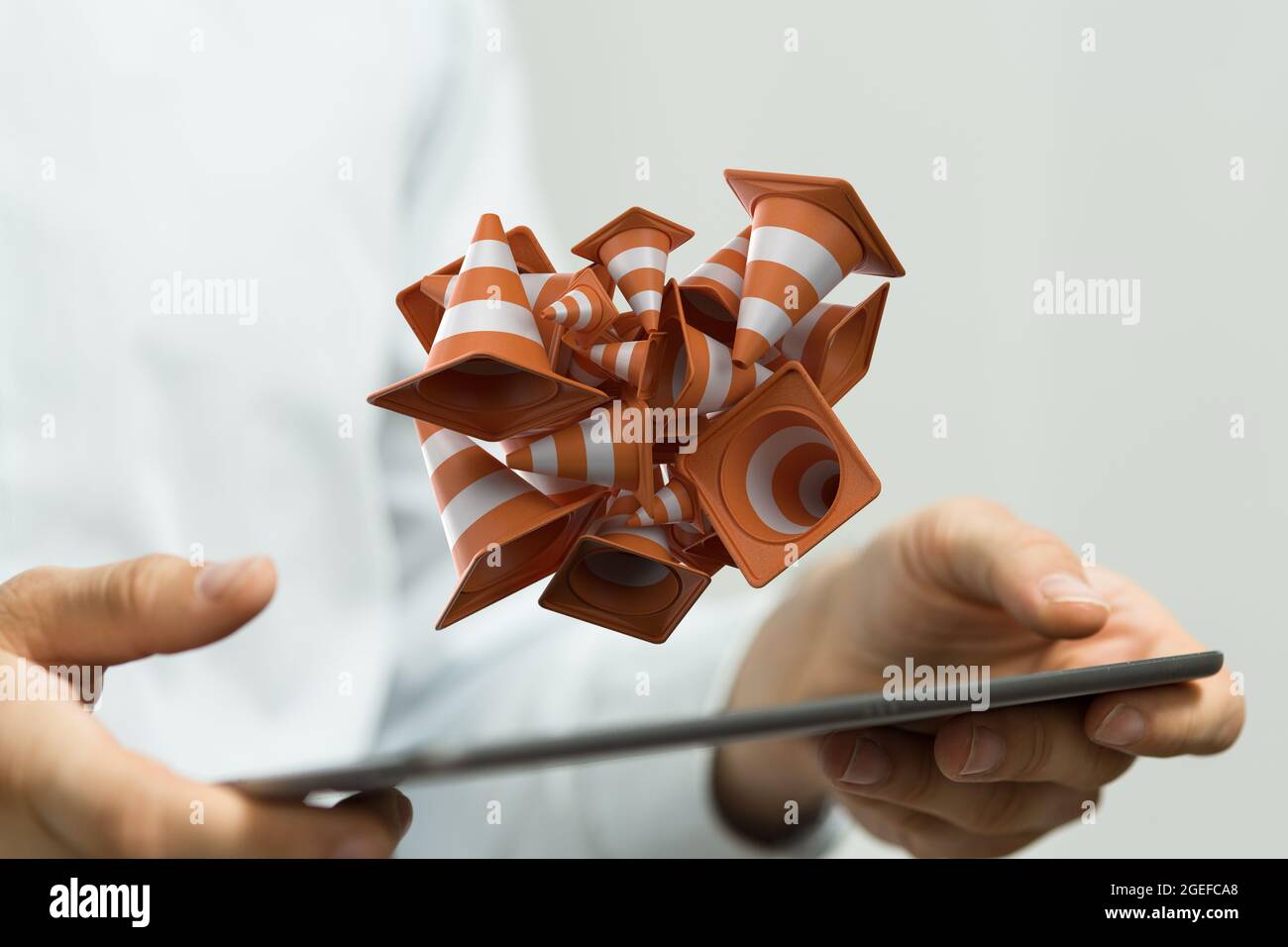 3D render of floating traffic cones over a businessman's hands- site ...