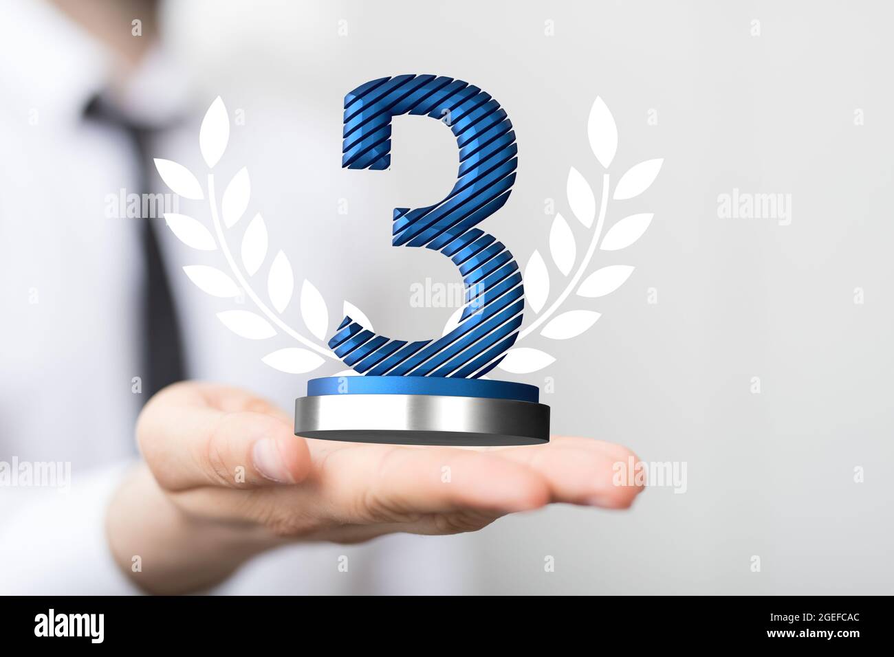 Hand holding a 3D decorative 3rd place trophy sign Stock Photo - Alamy