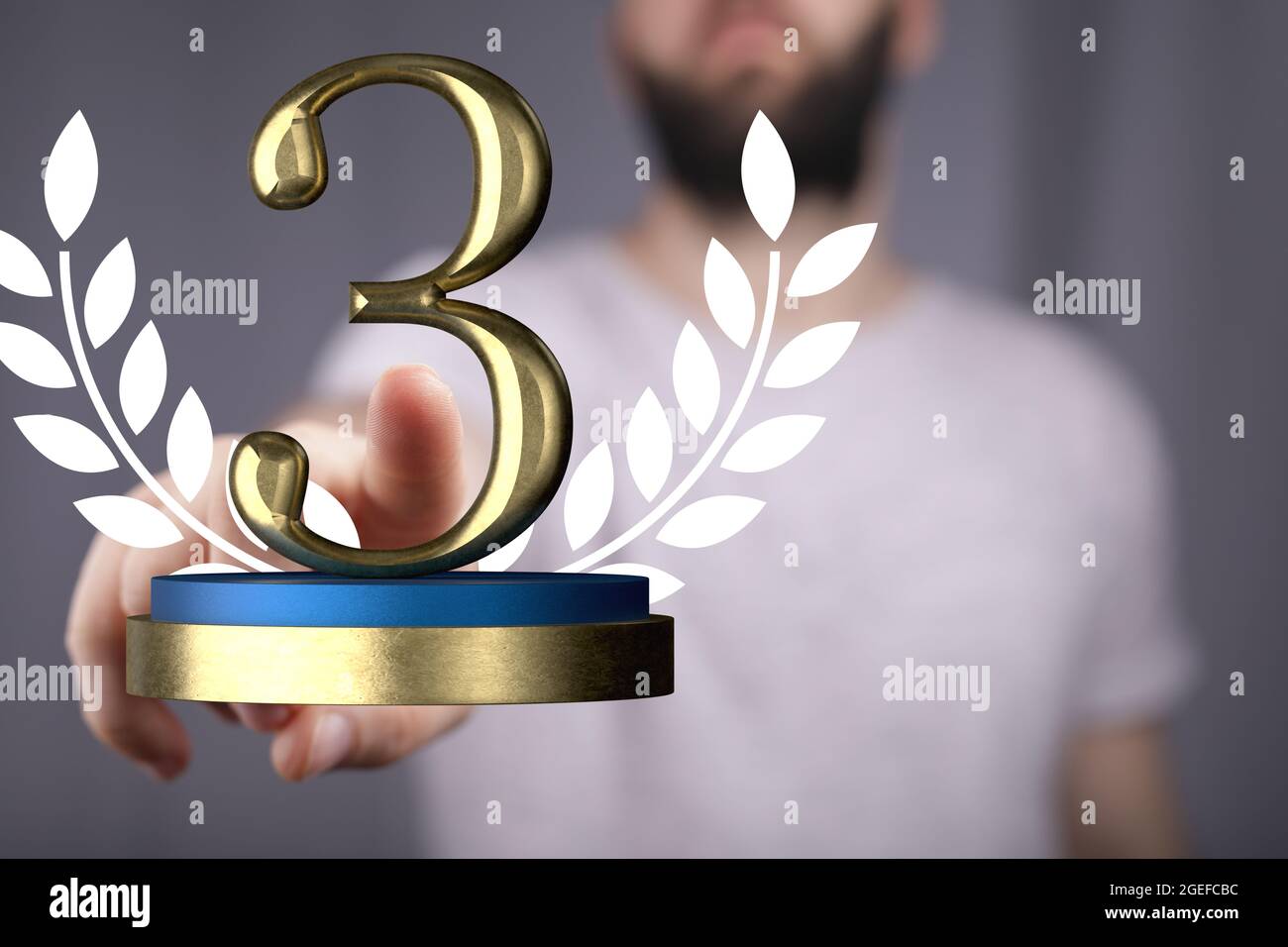 Hand pointing to a 3D decorative 3rd place trophy sign Stock Photo - Alamy