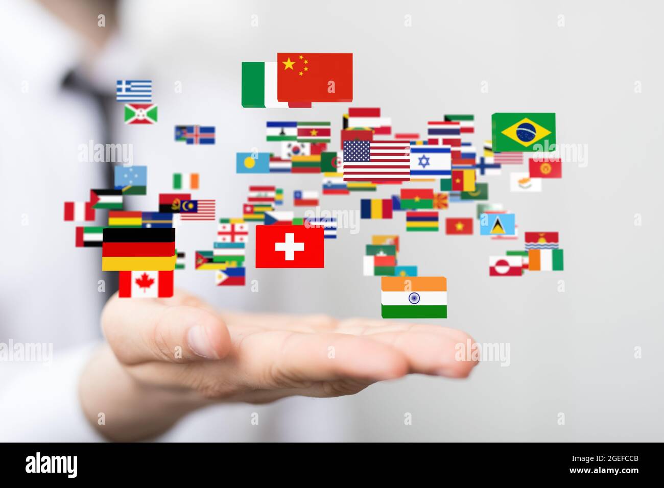 Hand holding an interconnected network of international flags Stock ...
