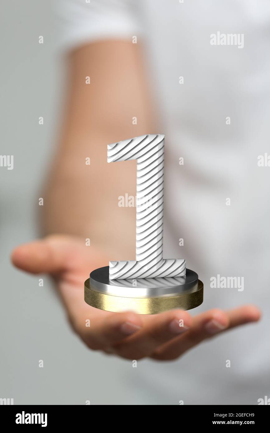 Vertical shot of a hand holding a 3D decorative 1st place trophy sign ...