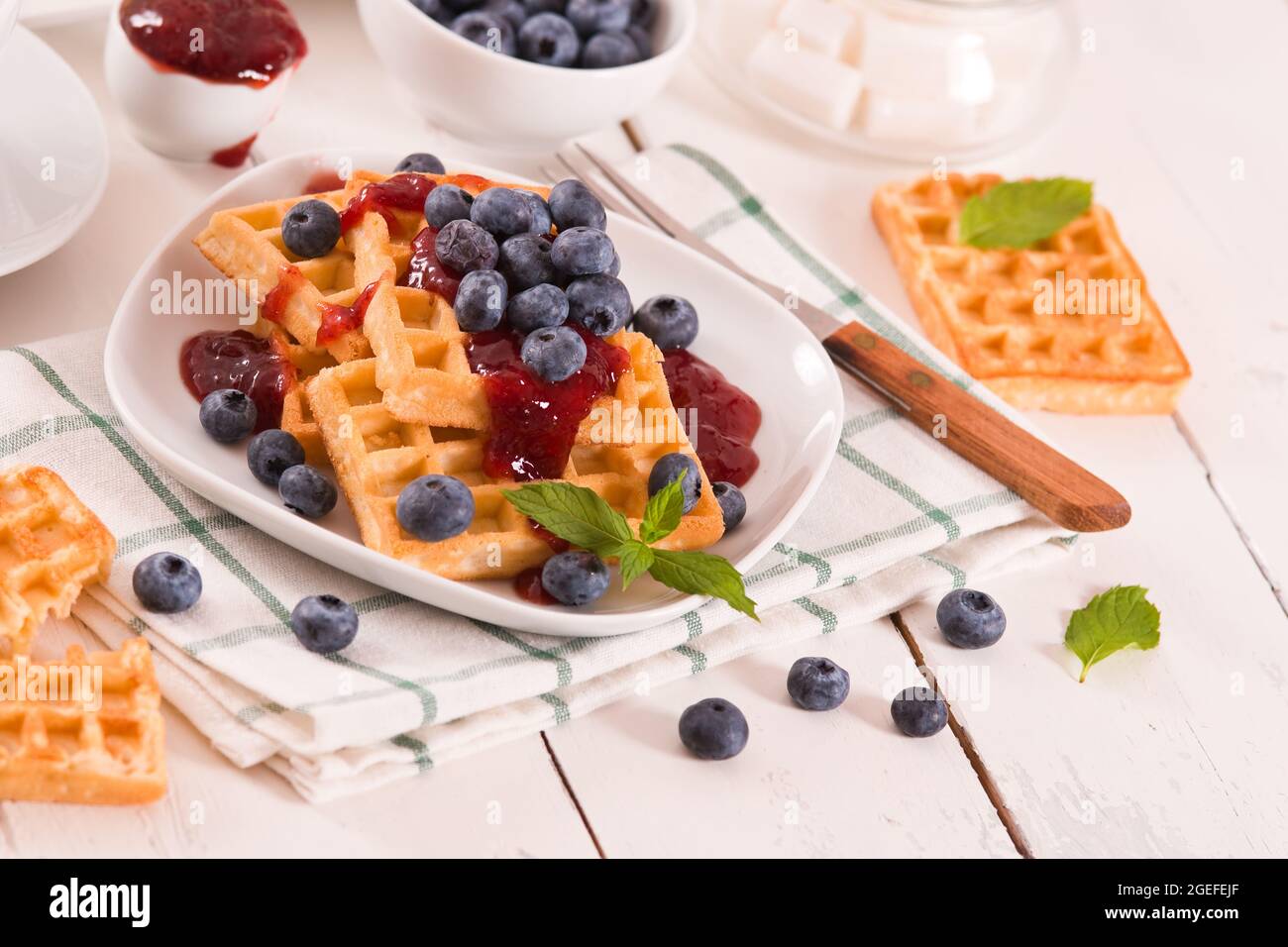 Waffles with blueberries and jam Stock Photo - Alamy