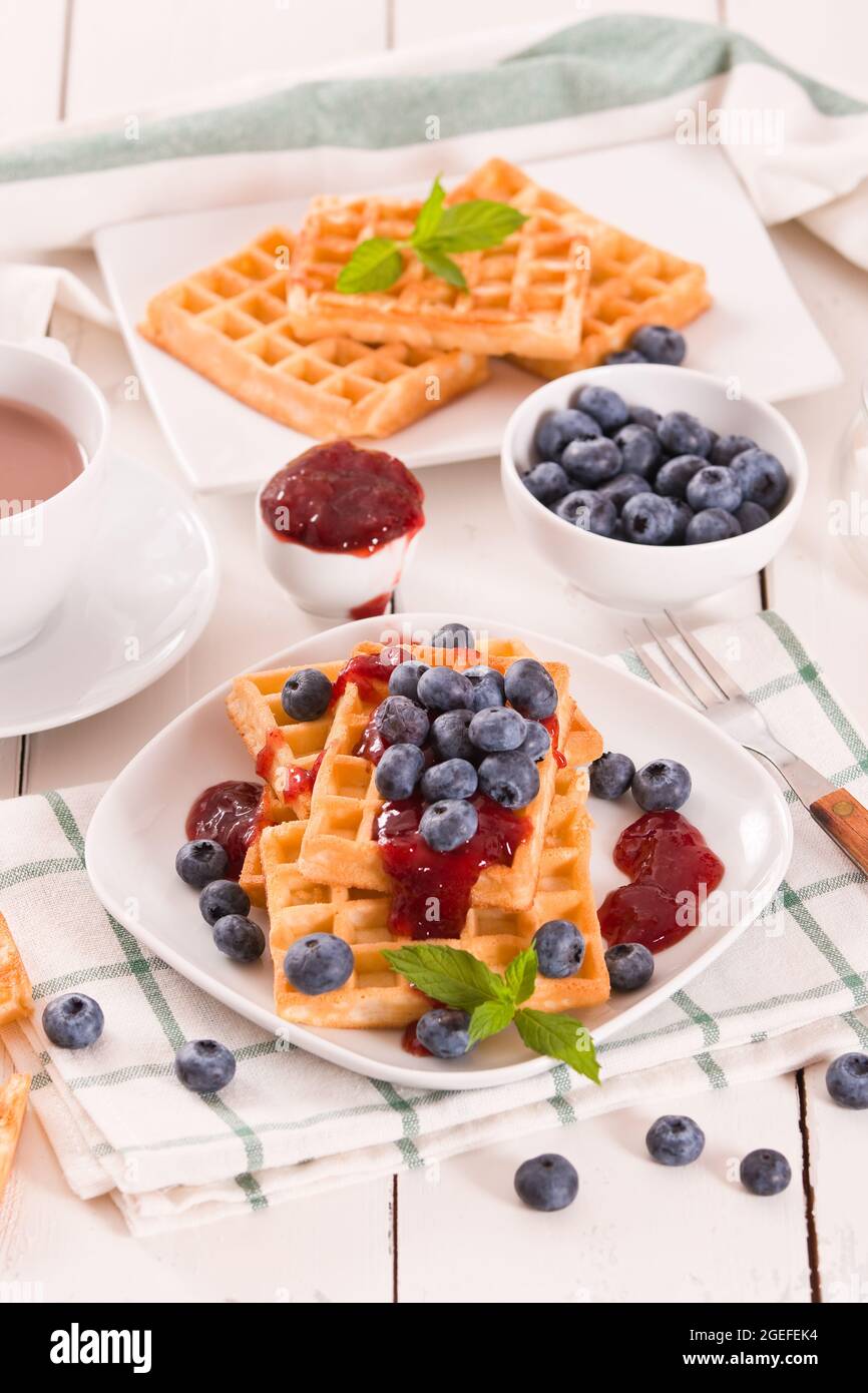 Waffles with blueberries and jam Stock Photo - Alamy