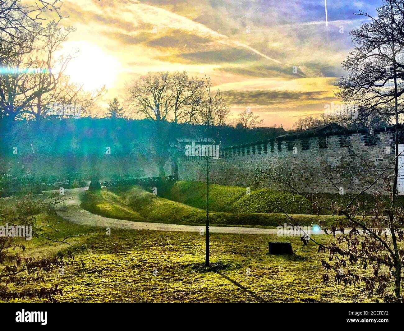 Beautiful view of a castle wall, pathway, and a field Stock Photo - Alamy