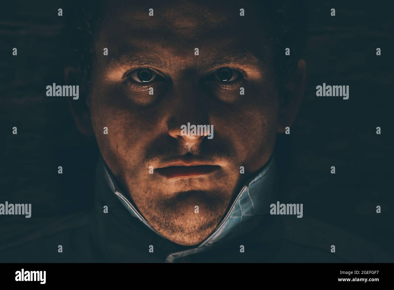 Mans face in dark hi-res stock photography and images - Alamy