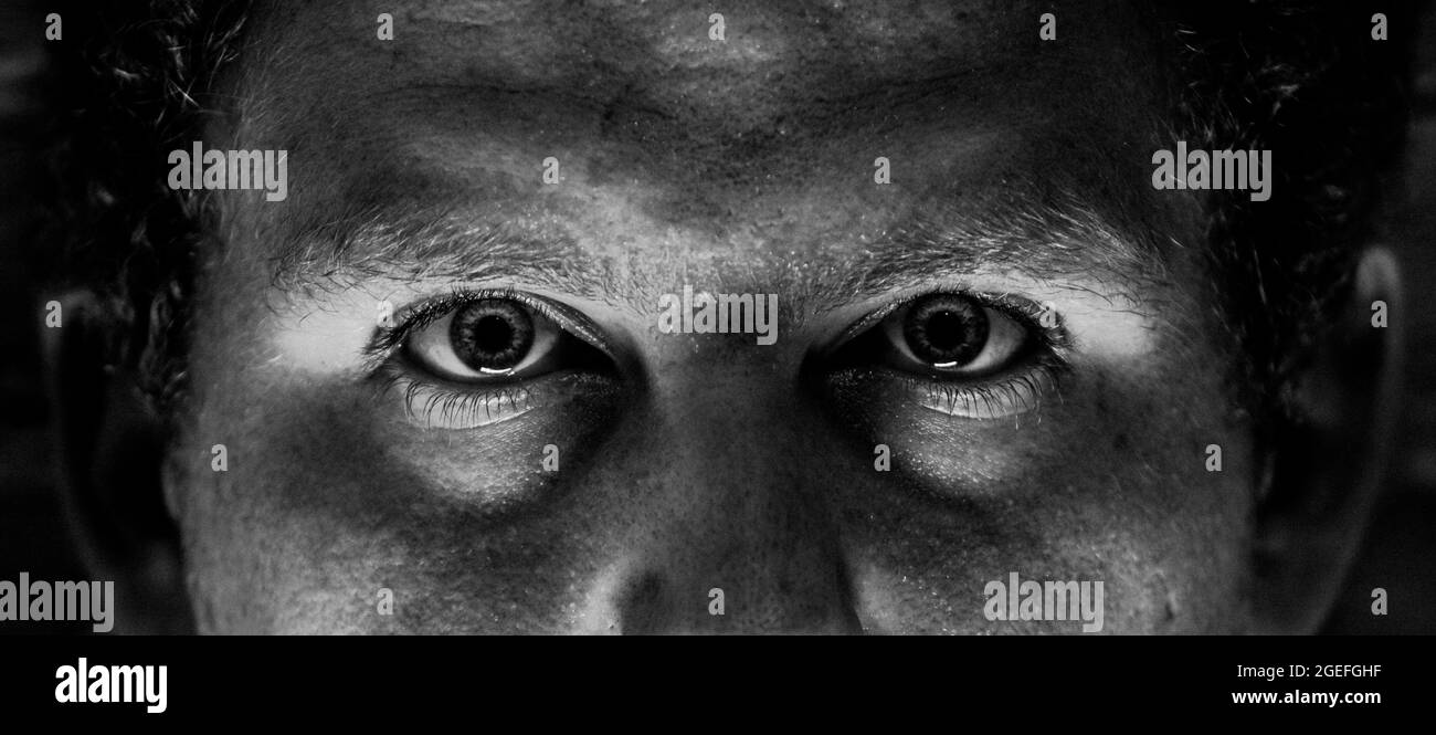 Grayscale closeup of a man's face in deep shadows Stock Photo - Alamy
