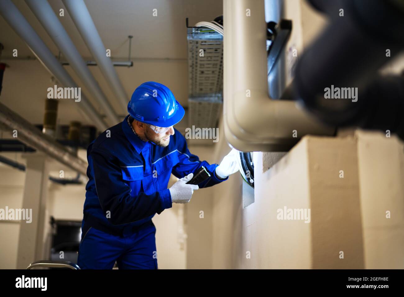 PVC Water Pipe Inspection By Construction Worker Stock Photo - Alamy