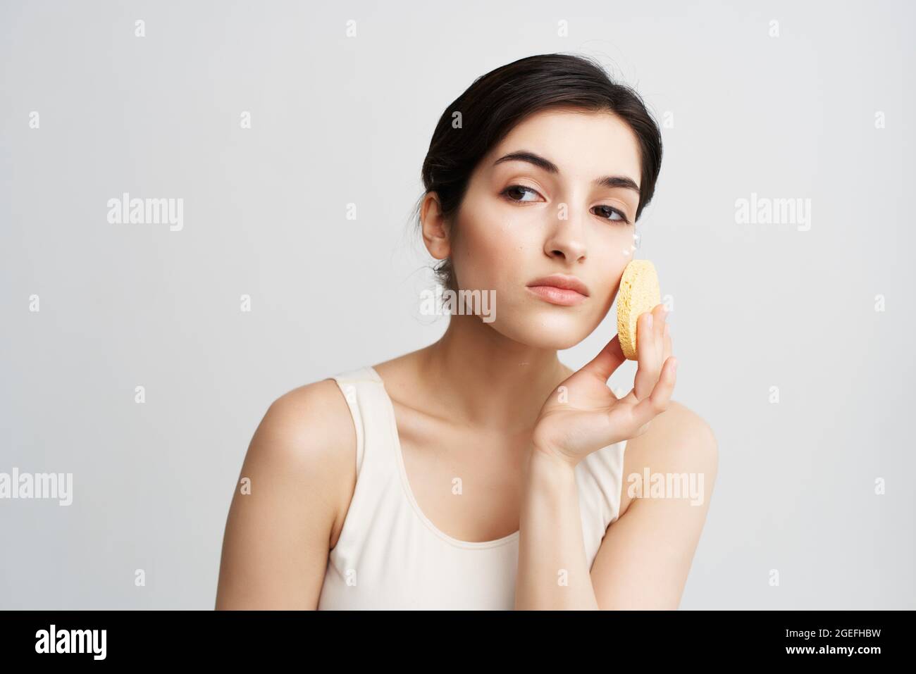 pretty woman applying cream on face clean skin care close-up Stock ...
