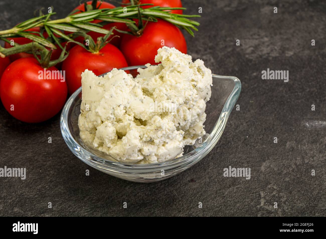 Soft cream cheese with herbs in the bowl Stock Photo - Alamy